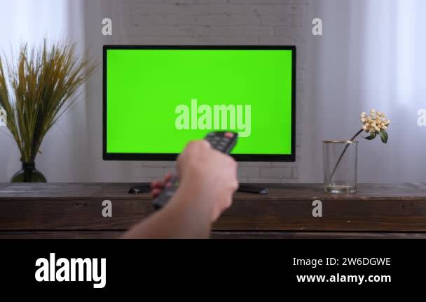 Control remote hand changing channels TV screen plasma panel. Smart ...