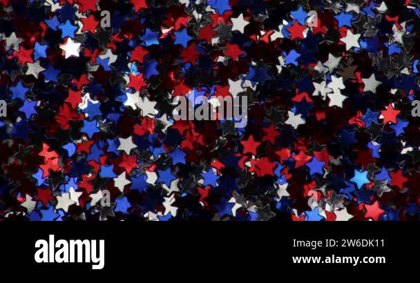 Video with bright red, blue and white glitter stars like the US flag ...