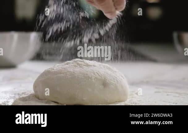 Baker prepares dough for traditional Italian pizza. chef in bakery ...