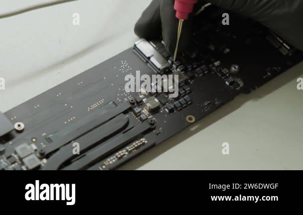 Close up view of electronic renovation in repair shop, testing electric ...