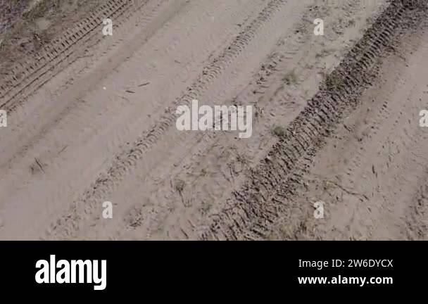 tire marks on the road. sandy road. Car wheel tread trace on the sand ...
