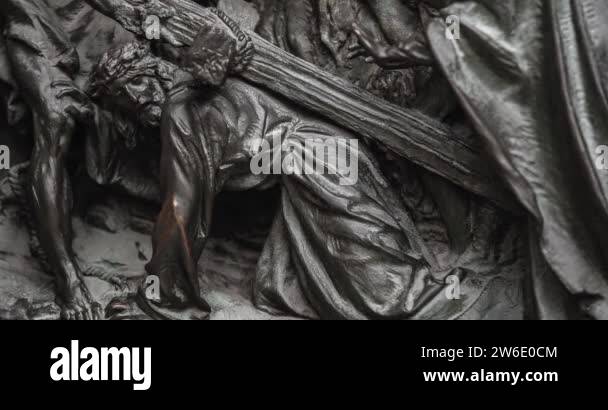 Statues of crusified Jesus and two criminal bandits filmed in close up ...