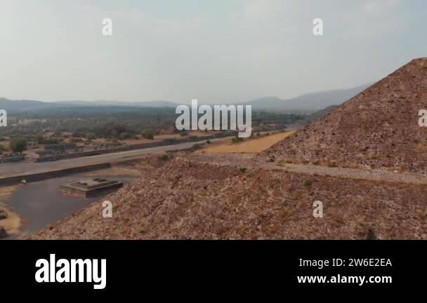 Forwards fly around corner of pyramid. Revealing panoramic view of dry ...