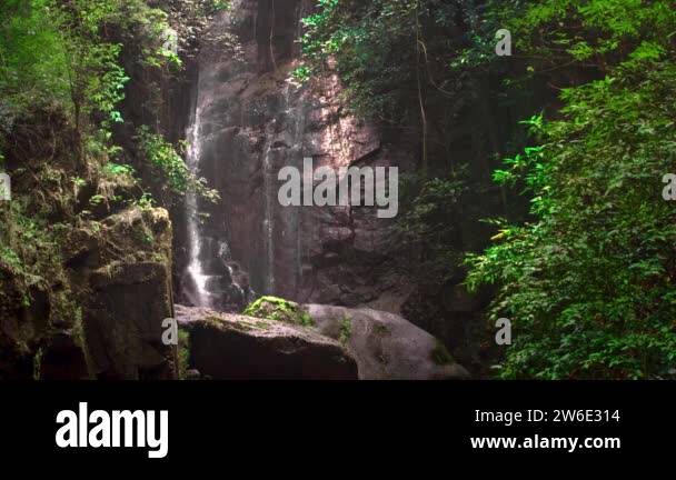 beautiful water flow from waterfall in deep forest mountain after rain ...