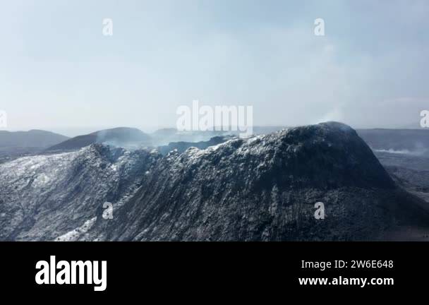Backwards reveal of barren landscape covered with layer of solidified ...