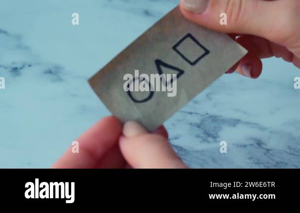 Kiev Ukraine - October 2021 Hand holding a squid game invitation card ...