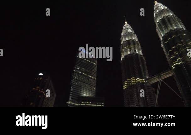 Night front view of the Beautiful Petronas twin towers in Kuala Lumpur ...