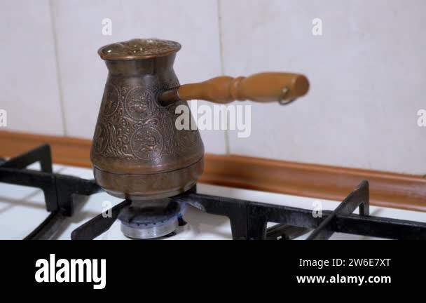 Preparing Ground Turkish Coffee in a Copper Turk on a Gas Stove. 4K ...