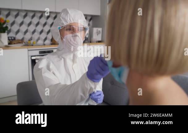 Video of female doctor taking a nasal swab test. Shot with RED helium ...