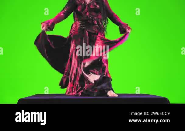 A barefoot gypsy woman without a face with long black hair in a red ...