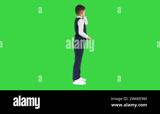School boy touching virtual screen on a Green Screen, Chroma Key Stock ...