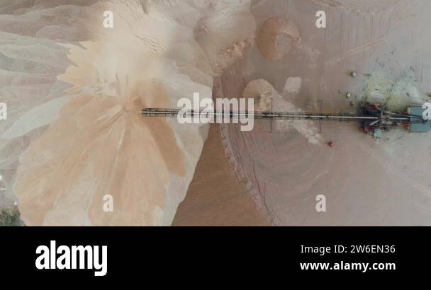 Salt piles, aerial view of industrial quarries, conveyor in salt pits ...