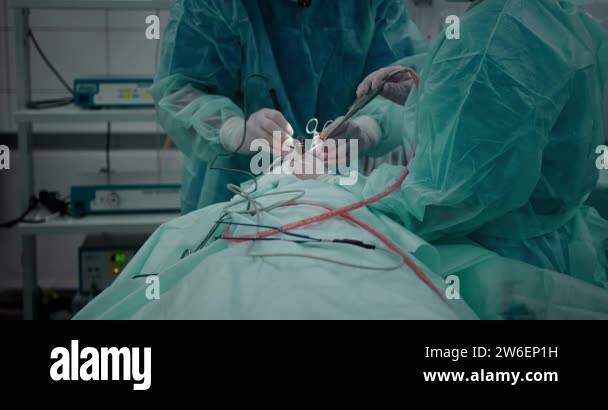 The doctor performs a pediatric surgical operation to remove the ...