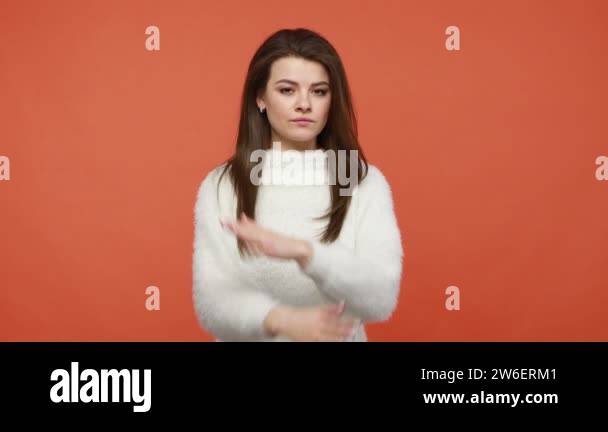 There is no way. Serious bossy woman with brown hair in white sweater ...