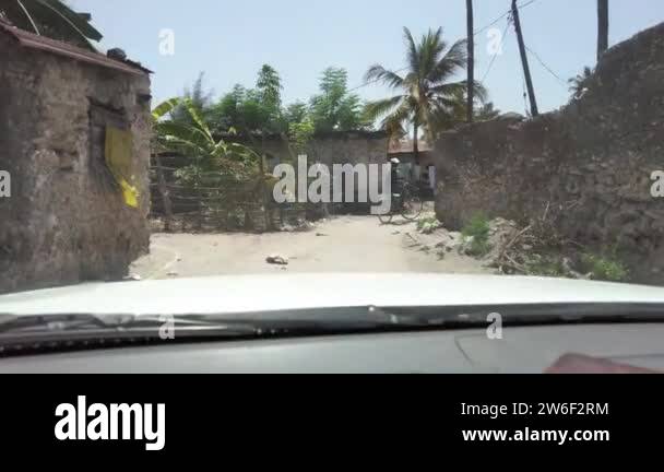 Driving Past Slums and Villages with Dilapidated Houses among Palm ...