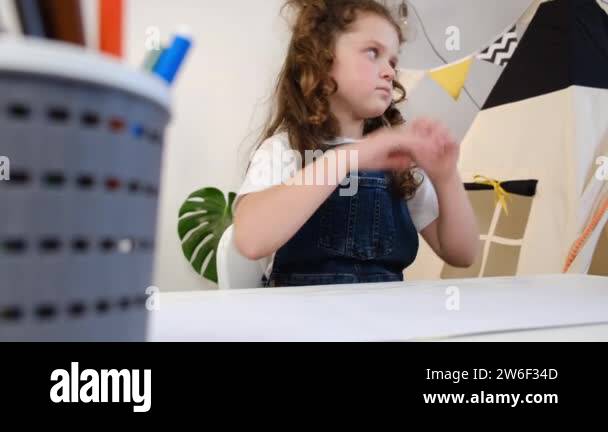 Selective focus of upset stressed little child feel scared hurt sitting ...