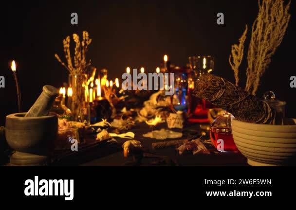 Witch ritual table arranged with witch craft magic items. Selective ...