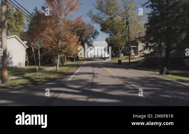 Drive through a typical American suburb as seen from the rear window of ...