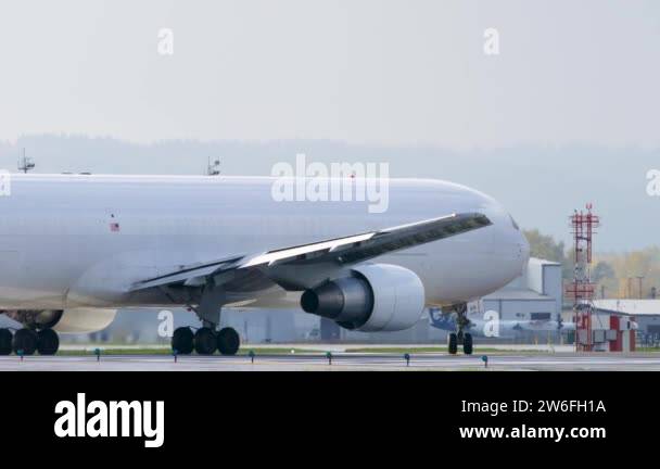 White widebody cargo Boeing 767-300BCF airplane lining up with the ...