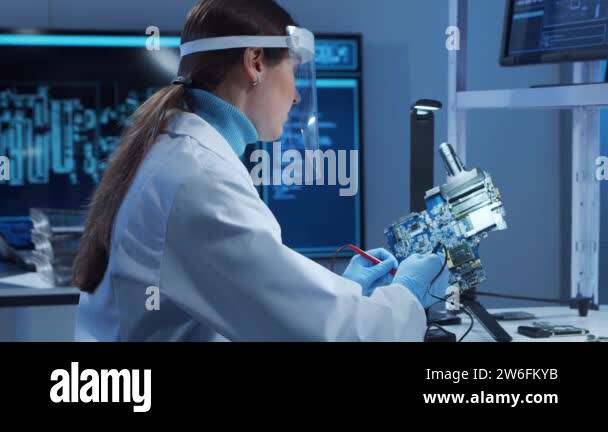Female microelectronics engineer works in a modern scientific ...