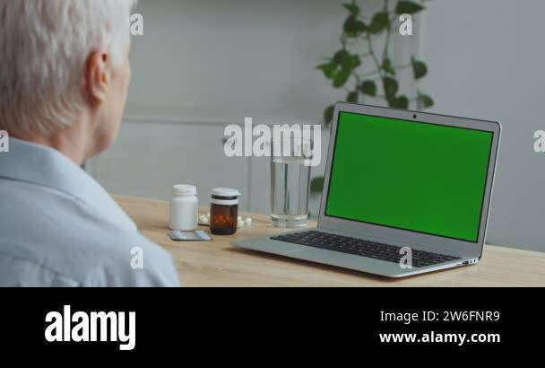 Close-up view from behind gray-haired unrecognizable old woman ...