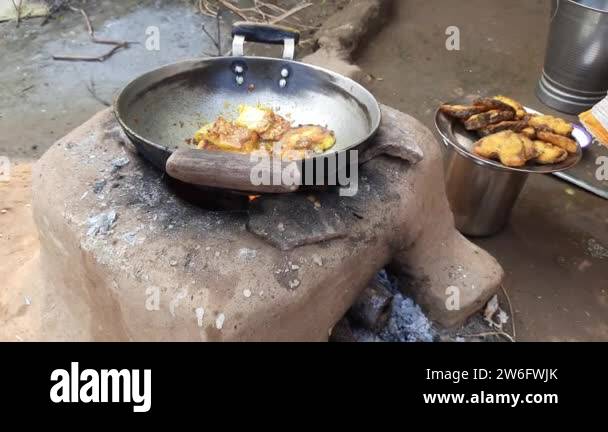 Fish Frying in wooden stove. Traditional cooking style in India. Food ...