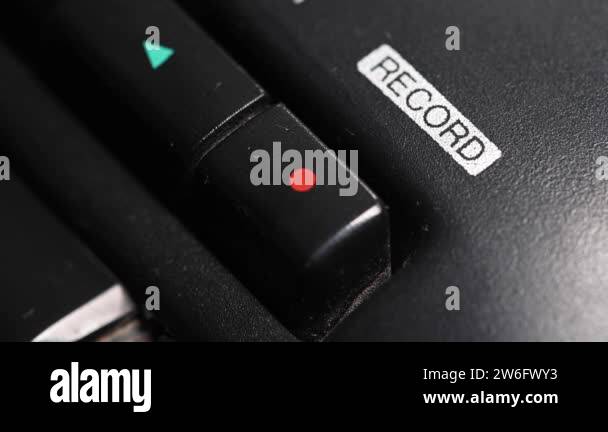 Audio cassette playback. Close-up. Pressing a finger rec button on an ...