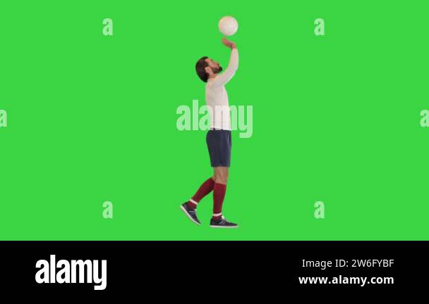 Football sportsman walking and bouncing a ball in hands like a ...