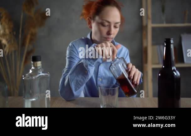Female alcoholism concept, drunk girl taking a bottle of whiskey ...