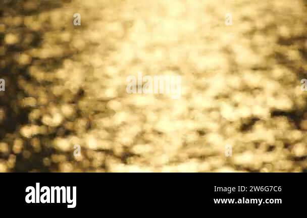 Bokeh sun glare reflection of Sunset sunrise light in water surface ...