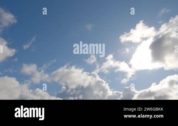 Blue sky white clouds. Puffy fluffy white clouds. Cumulus cloud cloudscape timelapse. Summer ...