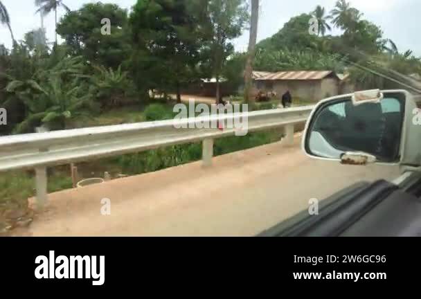 Driving Past Slums and Villages with Dilapidated Houses among Palm ...