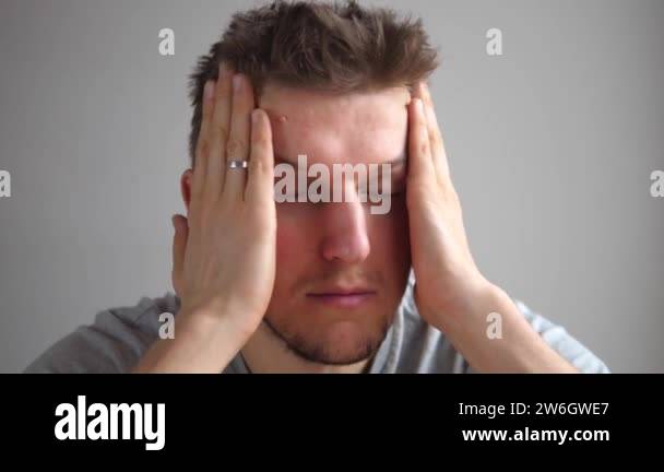 Stressed young man squeezing Stock Videos & Footage - HD and 4K Video ...