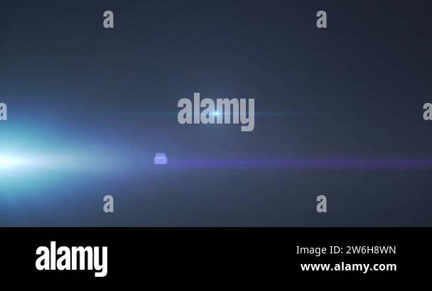 Animation of blue spotlight with lens flare and light beams moving over ...