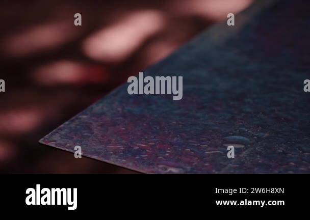 Copper. Metal plates. Drops of water are sprayed onto copper coating ...