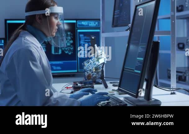 Female microelectronics engineer works in a modern scientific ...