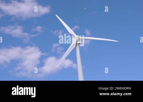 Wind power station with clear blue sky background. Wind turbine at ...