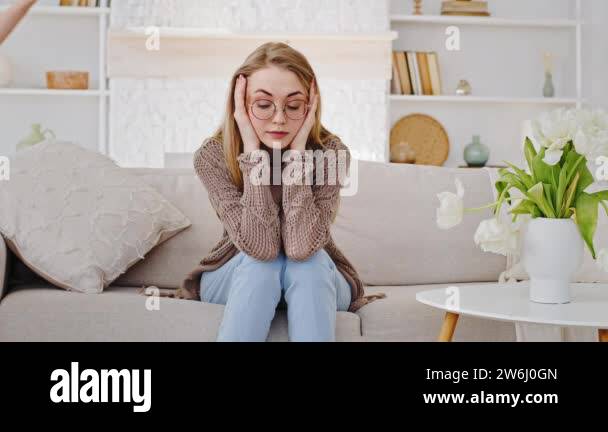 Young tired mother exhausted mom woman feeling stress headache holding ...