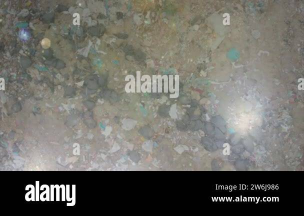 Spots of light over water pollution and rubbish underwater. environment ...