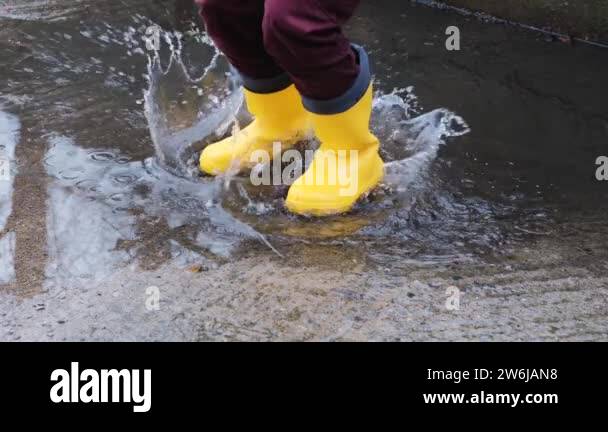 Jump through puddles in yellow rubber boots. Walk in rain and enjoy the ...