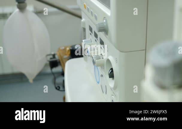 Medical worker adjusting and tuning artificial lung ventilation ...