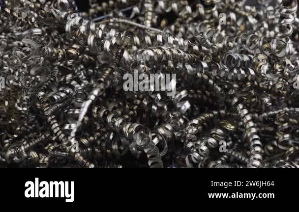 Metal shavings, twisted steel colored aluminum spirals. Steel scrap ...