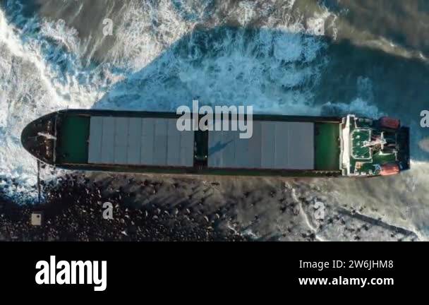 The dry cargo ship washed ashore during a sea storm. Oil spills. An ...