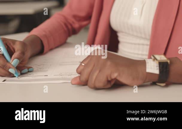 Steadicam of hands of cropped unrecognizable student with manicure ...