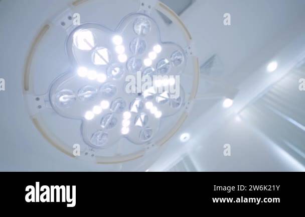 Bright surgical lamp light. Action. Blinding light of big lamp in ...