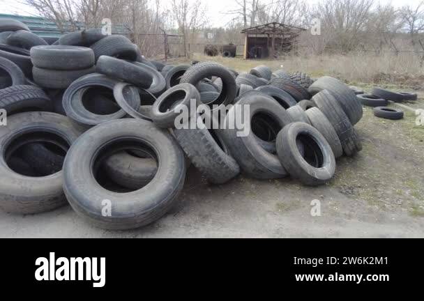 a mountain of old tires. dump of used wheels. Industrial landfill for the processing of waste ...