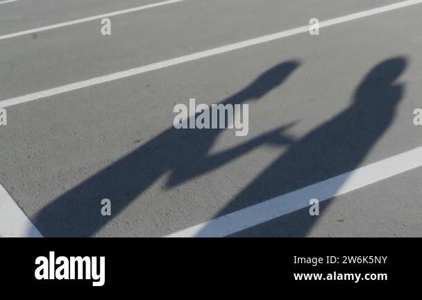 The silhouettes of two young men during angry conflict. HDR. Shadows of ...