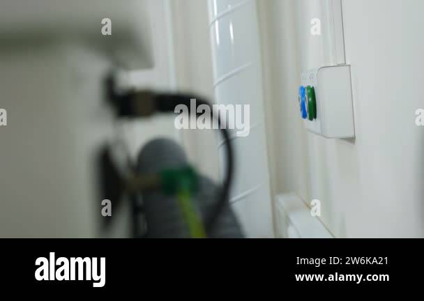 Medical worker hands plugging pipe and pipelines for oxygen, nitrous ...