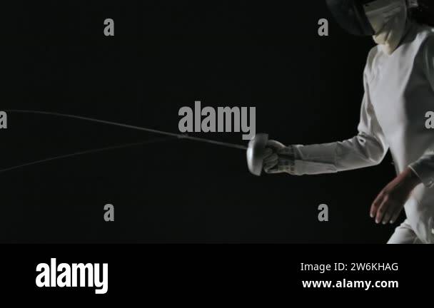 Hands of female fencers with rapiers close up on a black studio ...