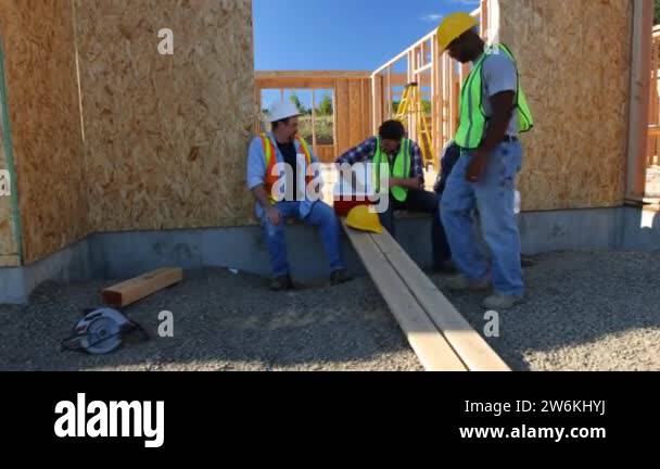 Group of construction workers taking a break Stock Video Footage - Alamy